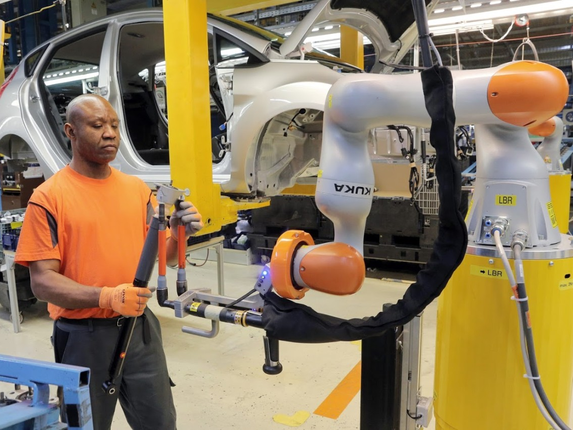 Car Workers Buddy Up With Robots – Man and Machine Work Hand-in-Hand as ...