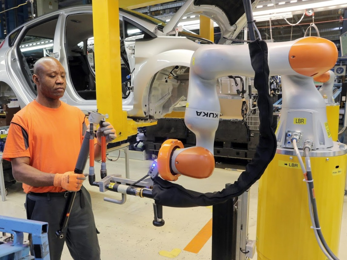 Car Workers Buddy Up With Robots – Man and Machine Work Hand-in-Hand as ...